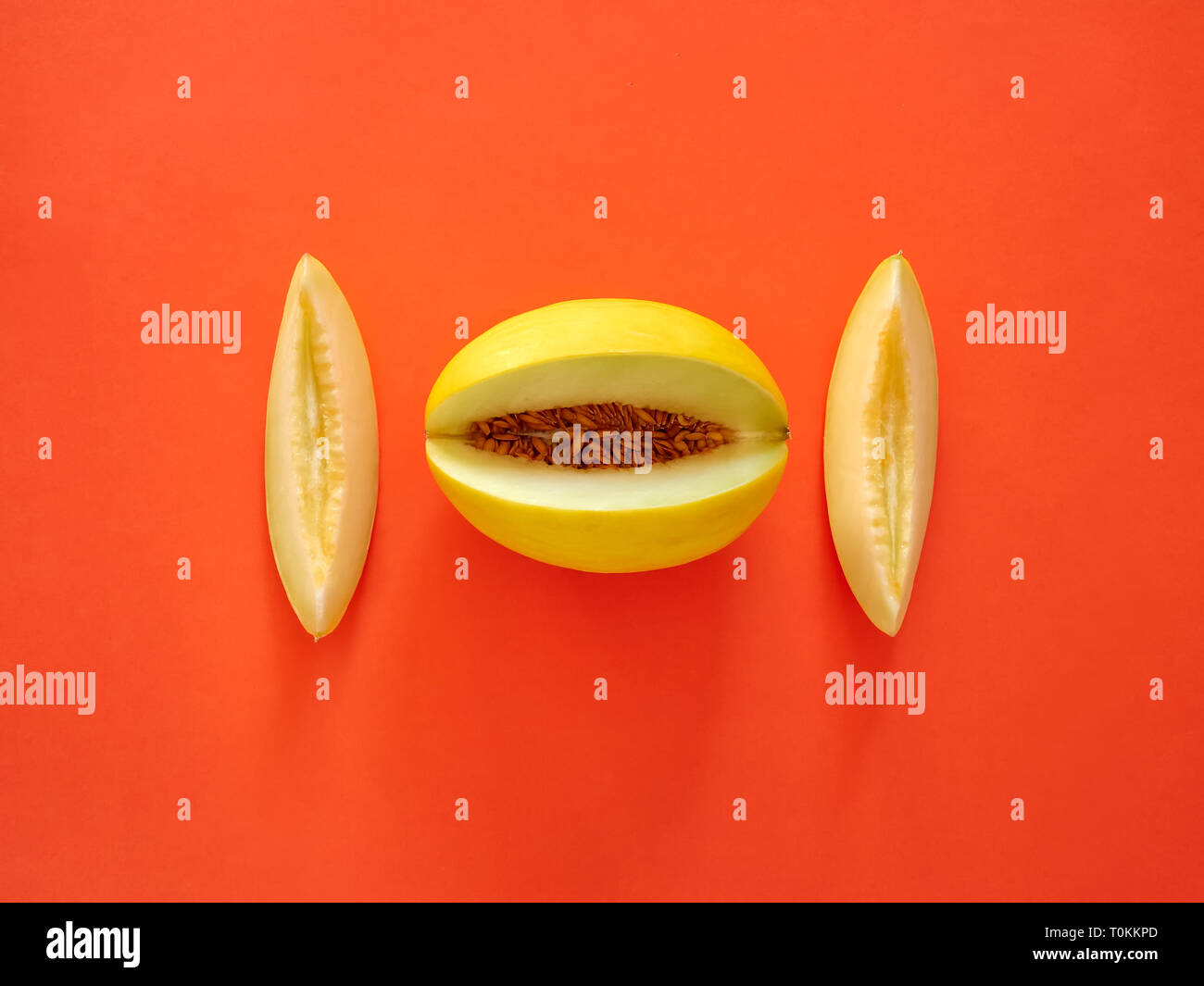 Yellow Melon Fruit isolated in orange background viewed from above ...