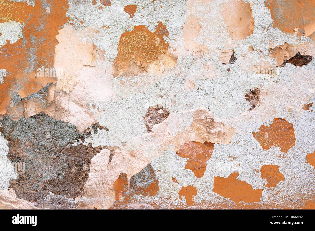 Close up detailed surface of weathered paint on different walls in high ...