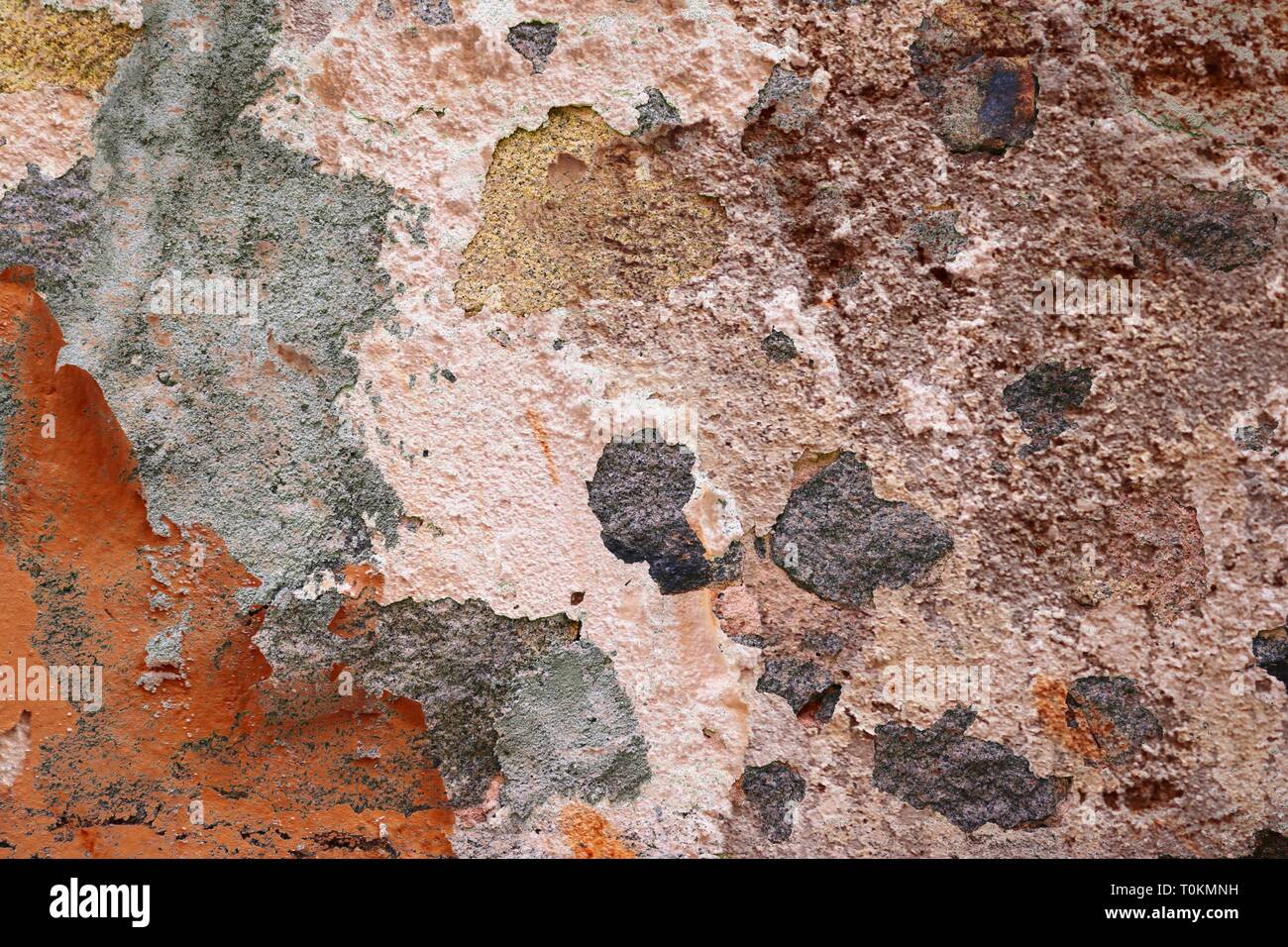 Close up detailed surface of weathered paint on different walls in high ...