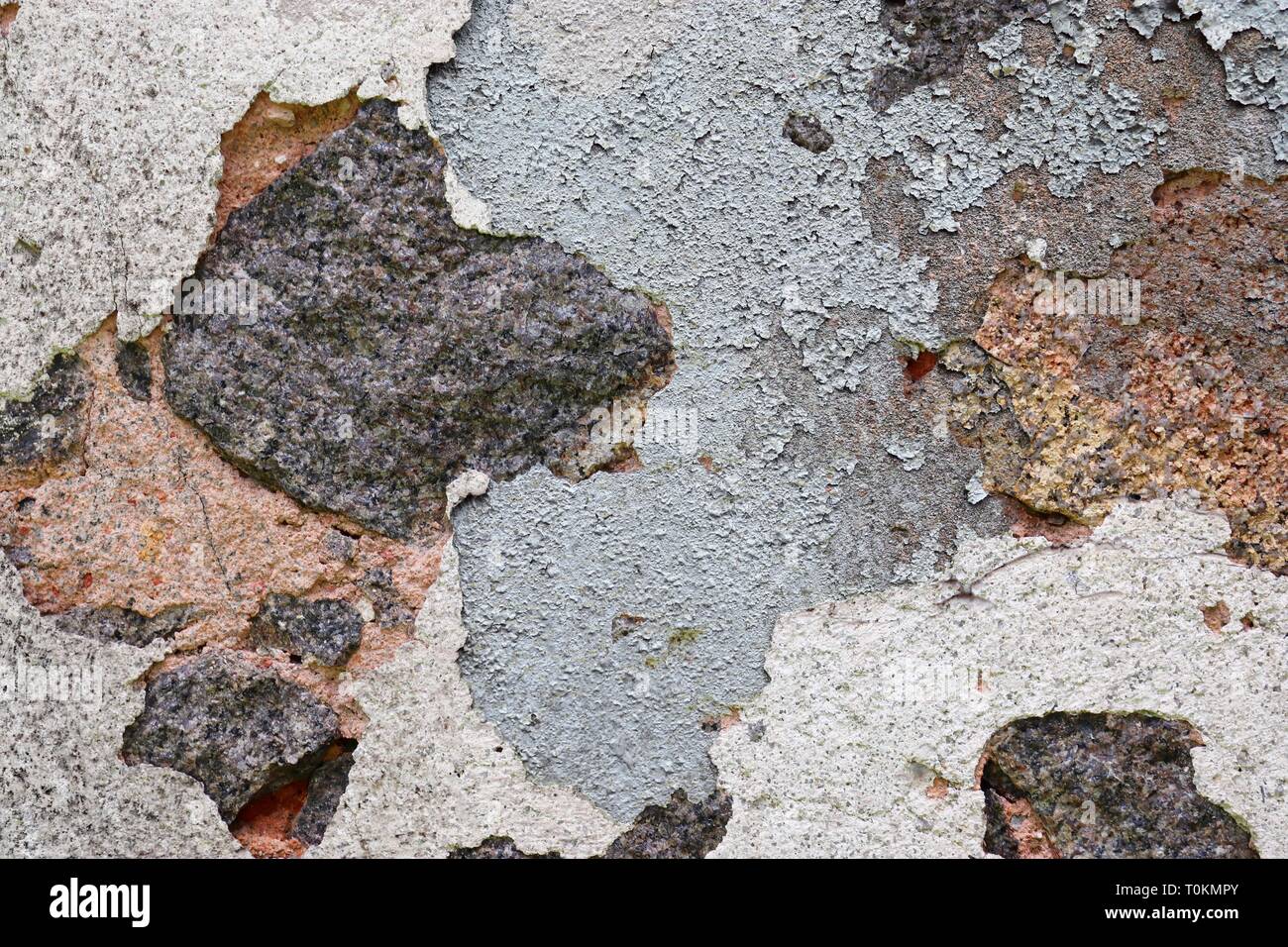 Close up detailed surface of weathered paint on different walls in high ...