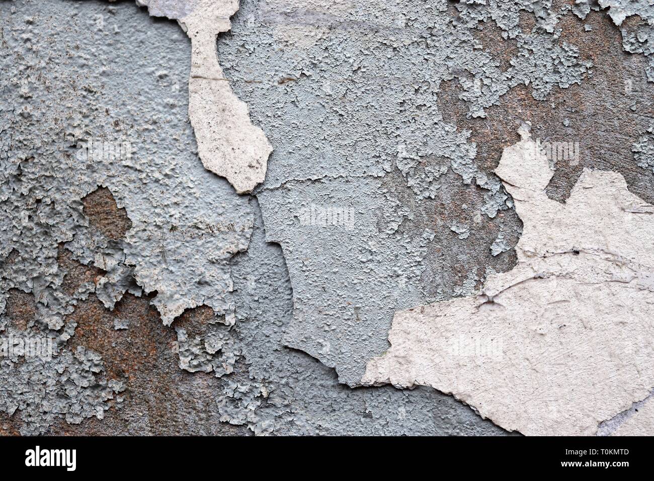 Close up detailed surface of weathered paint on different walls in high ...