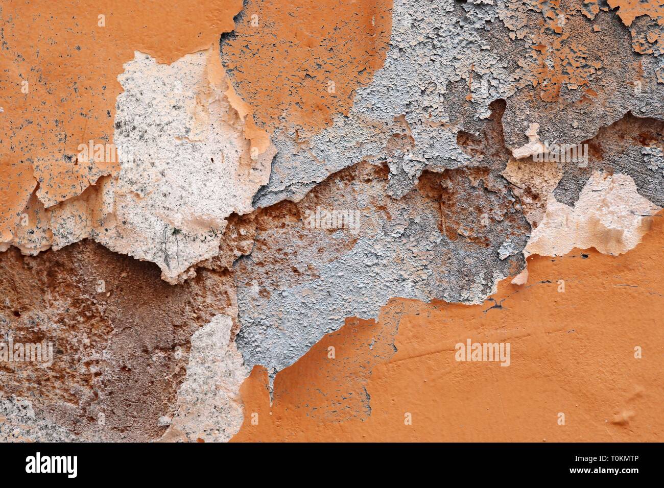 Close up detailed surface of weathered paint on different walls in high ...