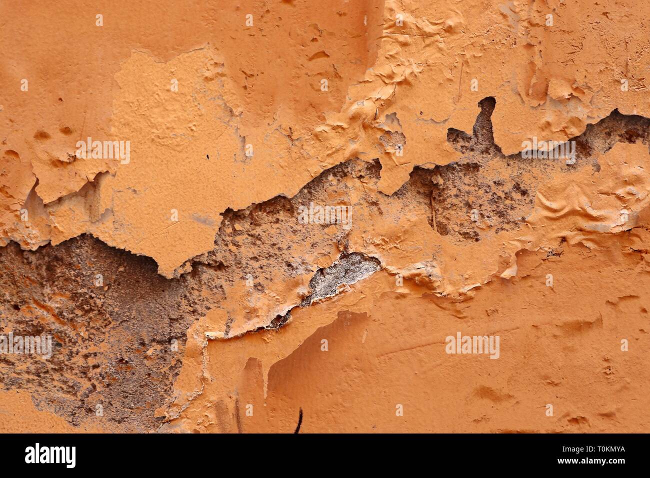 Close up detailed surface of weathered paint on different walls in high ...