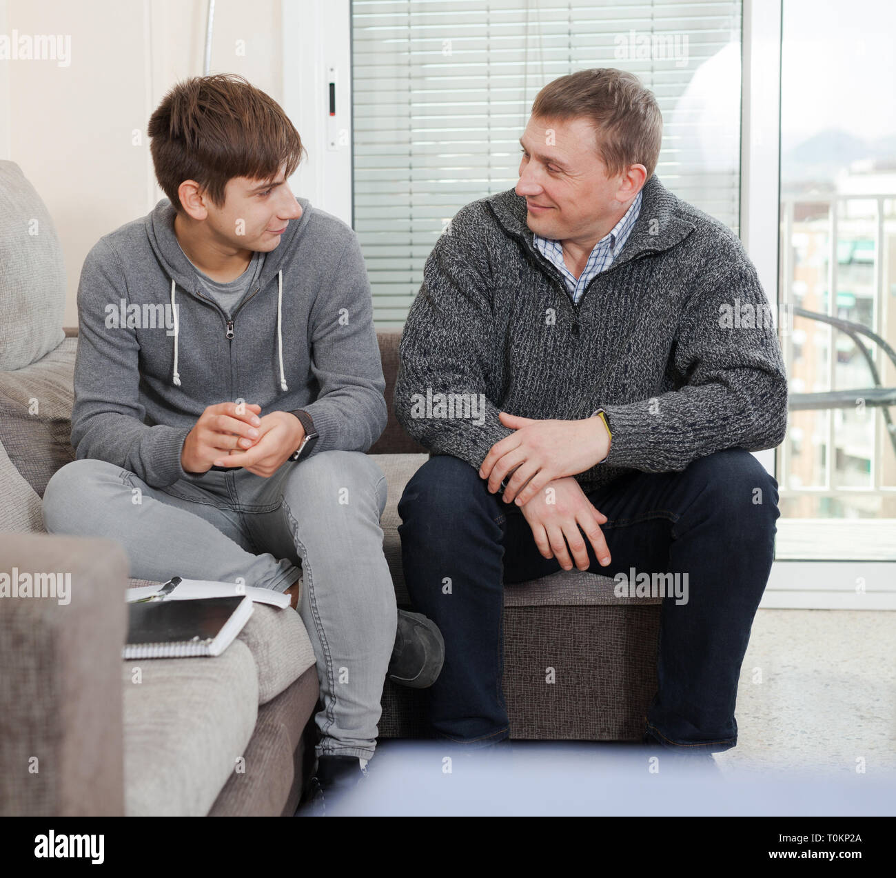 Guy with his father are resting and talking about teenage life Stock ...