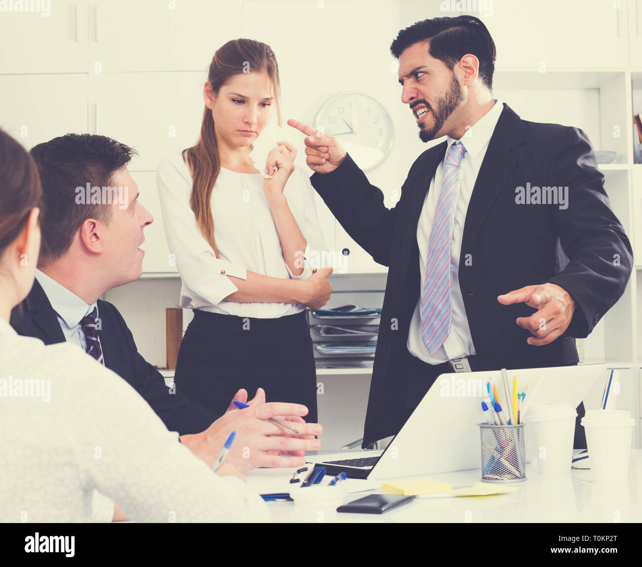 Irritated boss scolding subordinates pointing out shortcomings and ...