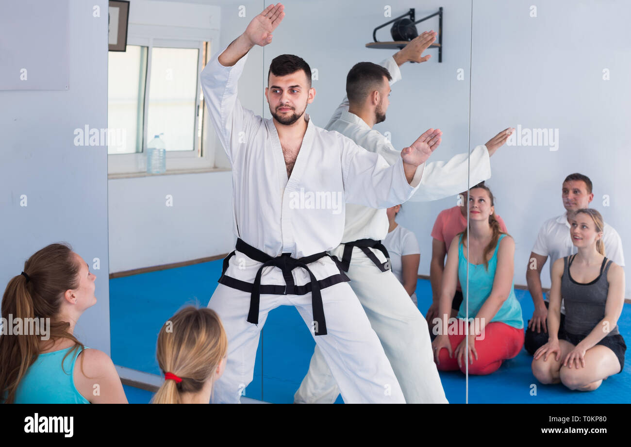 Young karate tool shows new movements of the self-defense of an adult ...