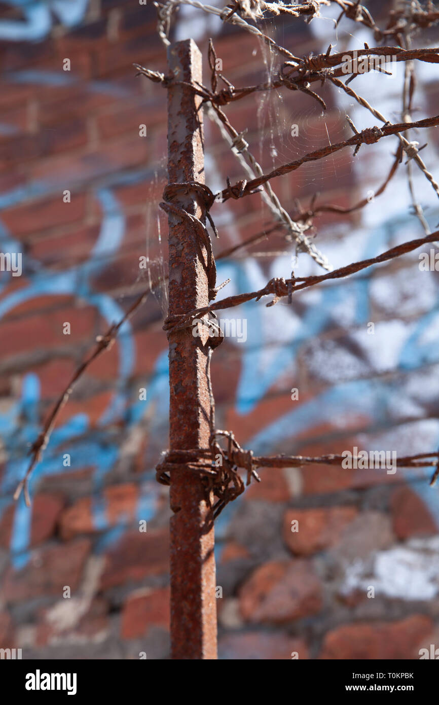 Sheffield graffiti, behind the barbed wire fence Stock Photo - Alamy