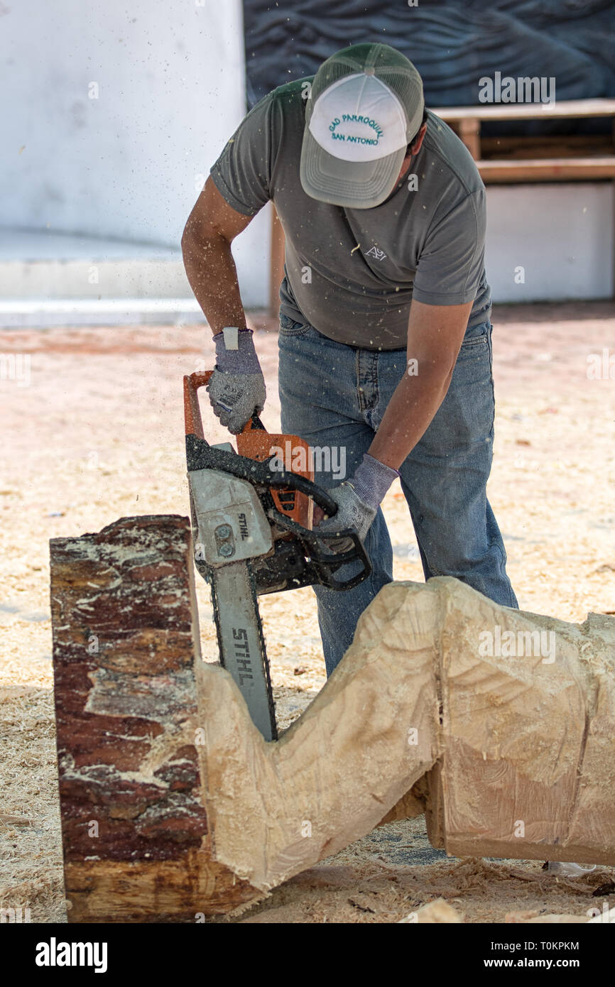 San Antonio de Ibarra, Ecuador - March 3, 2019: man carving wood with a ...