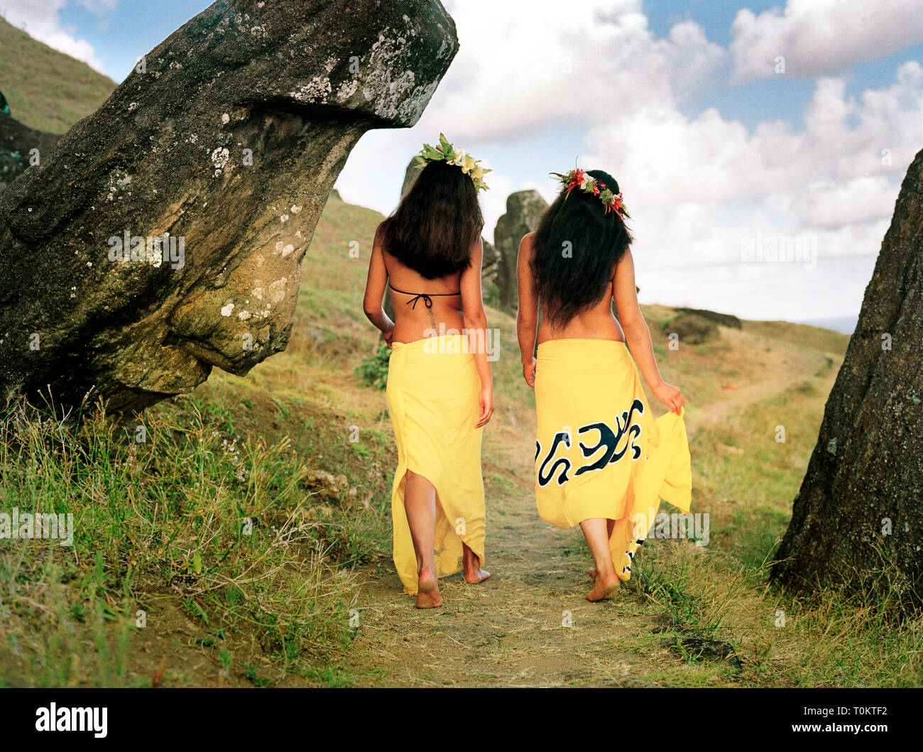 Two woman in traditional costume walking through hills Stock Photo - Alamy