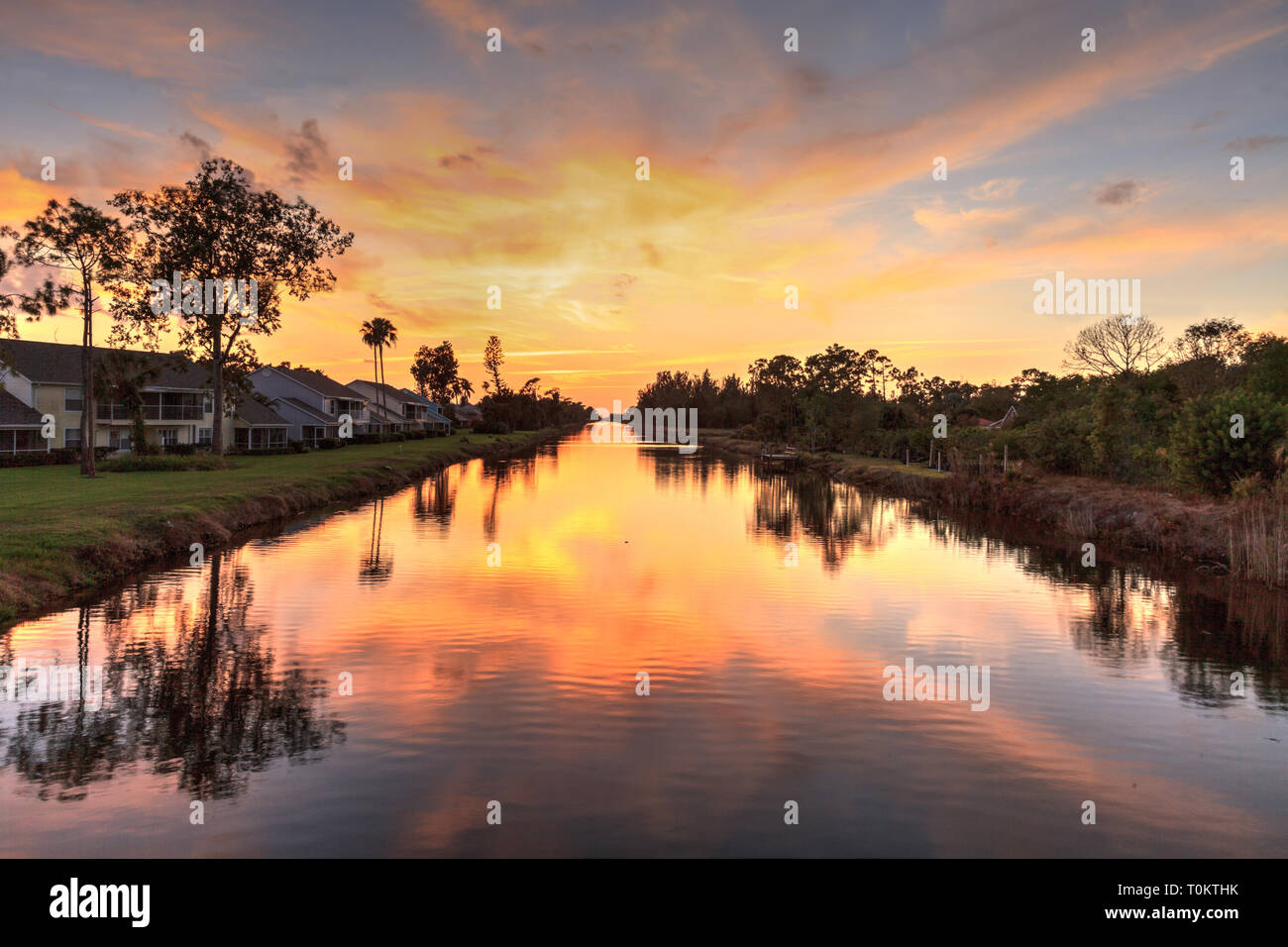 Golden sunset over a Gordon River tributary that winds through Golden ...