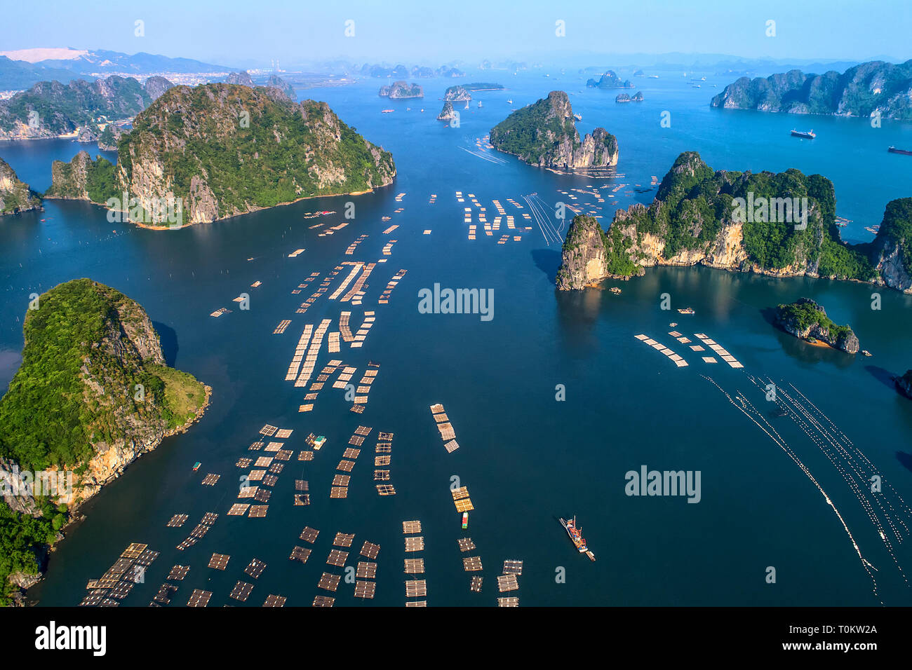 Floating fishing village and rock island in Bai Tu Long bay, Vietnam ...