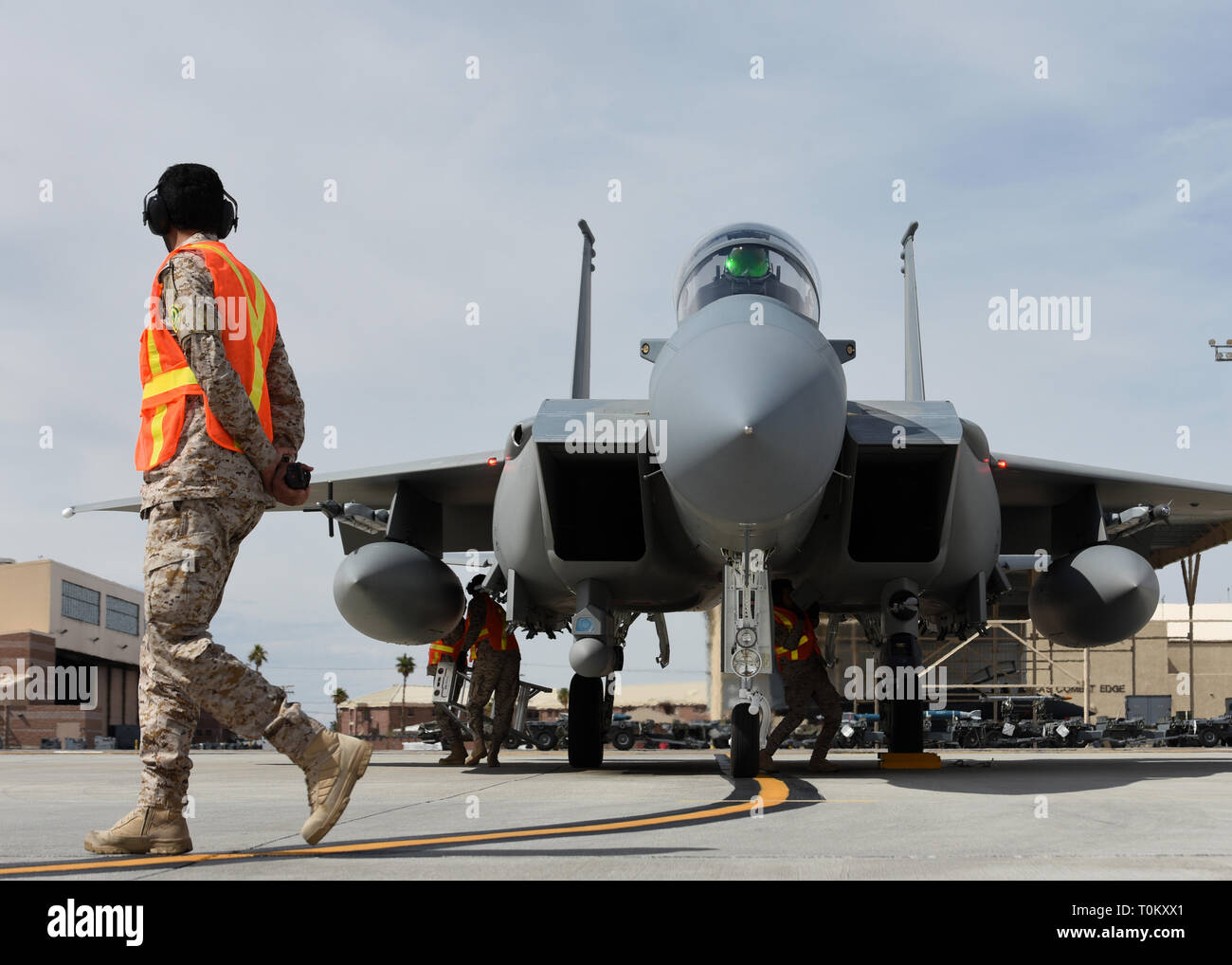 A Royal Saudi Air Force maintenance Airman walks around the F-15SA as ...