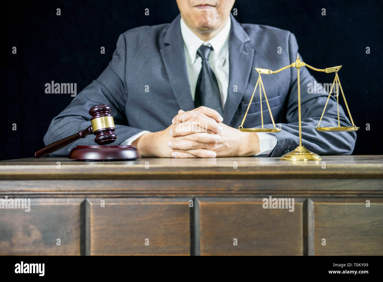 justice and law concept.Male judge in a courtroom working on wood table ...