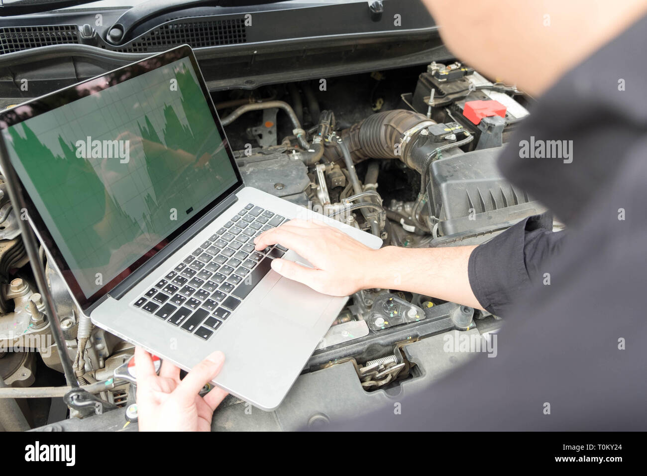 checking vehicle engine at the garage industrial concept, Hands of auto ...