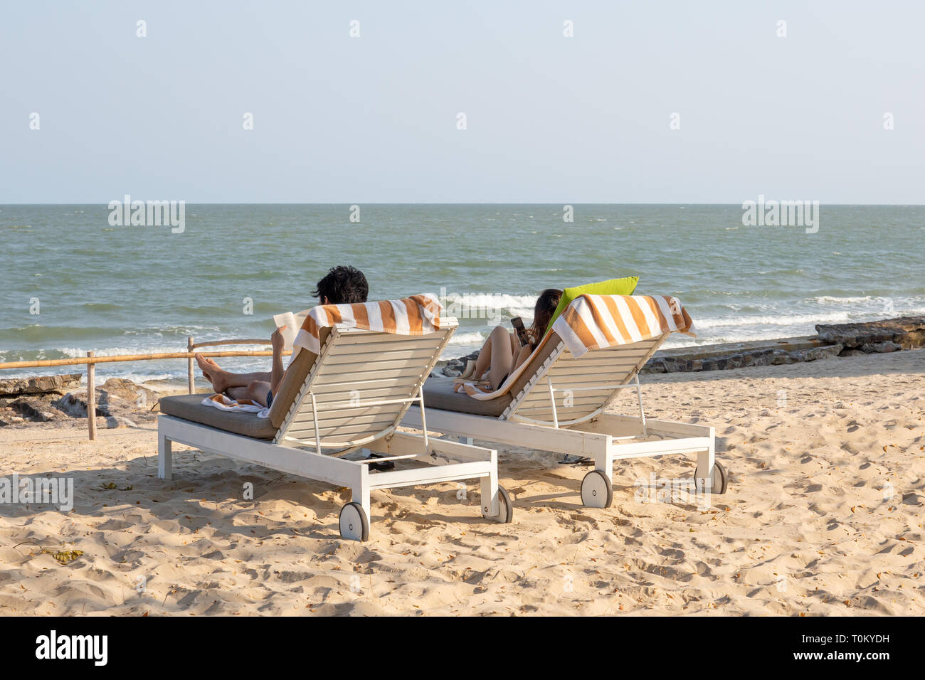Reading on the beach chair hi-res stock photography and images - Alamy