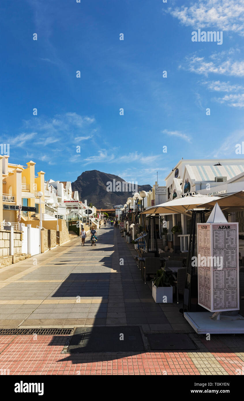 Street at Costa Adeje, Tenerife with shops and apartments or holiday ...