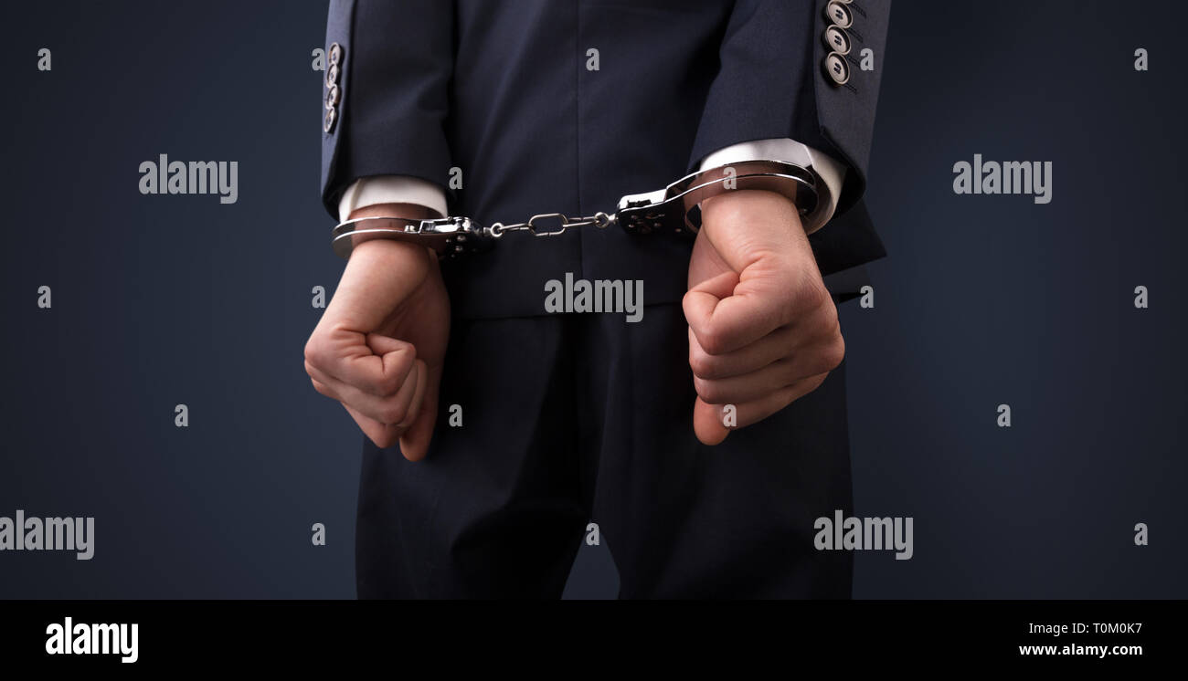 Close now arrested men hand with dark background and handcuffs Stock ...