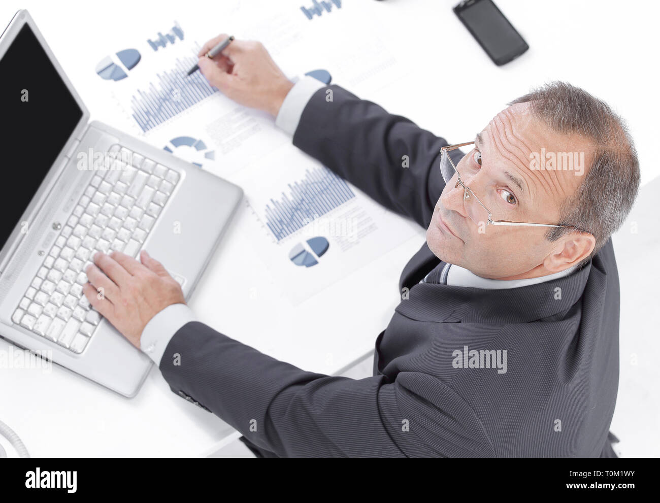 top view. responsible businessman looking at the camera Stock Photo - Alamy