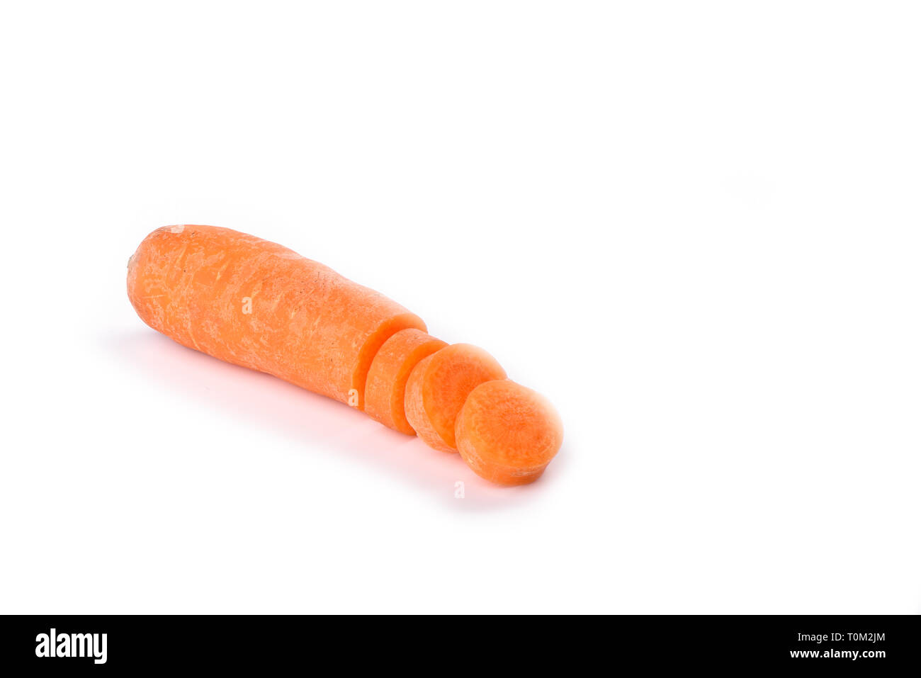 Carrot sliced into round slices isolated on white background. Copy ...