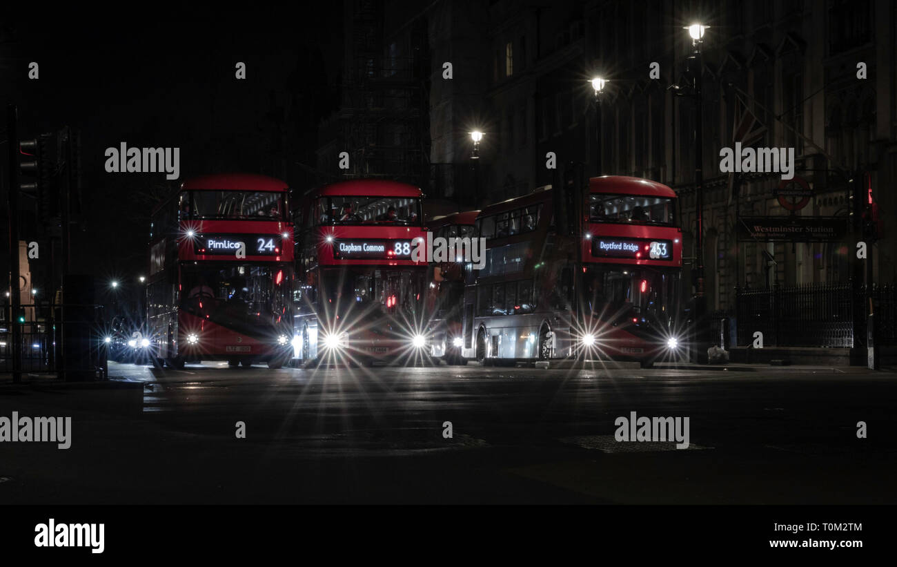 Famous red buses doing their duties at night London streets Stock Photo ...