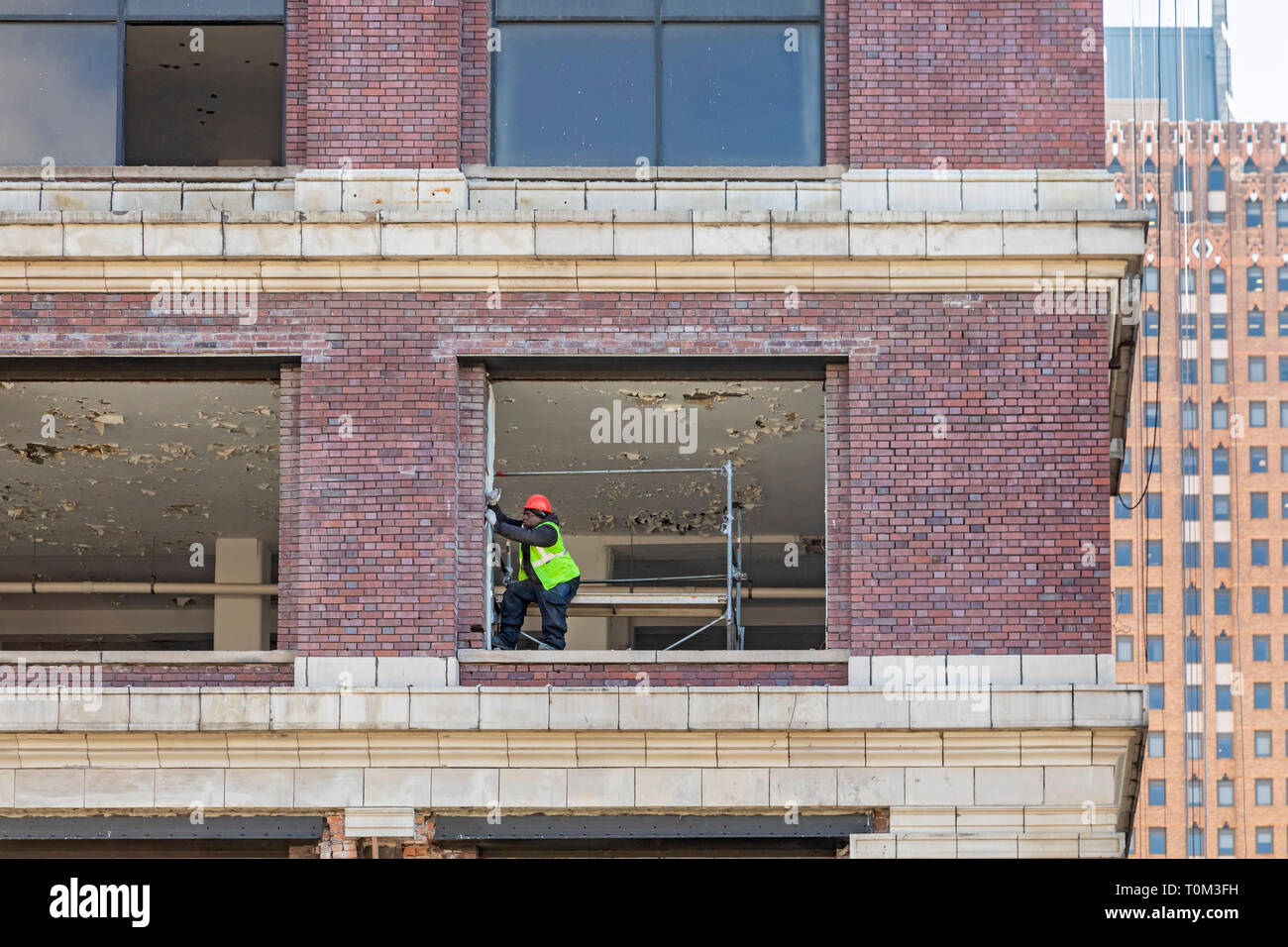 Detroit, Michigan - A construction worker at a window during the ...