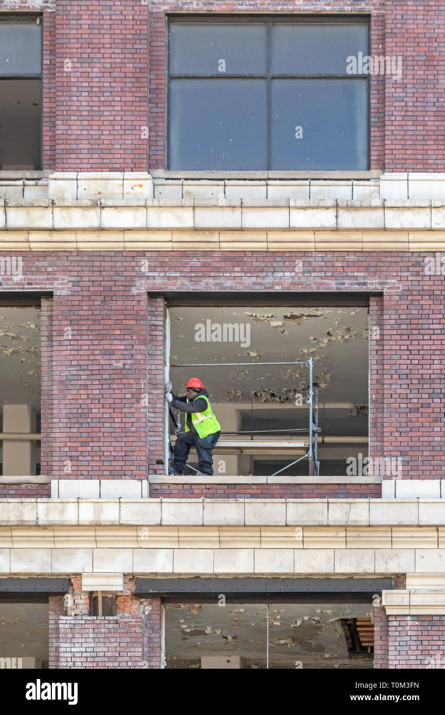 Detroit, Michigan - A construction worker at a window during the ...