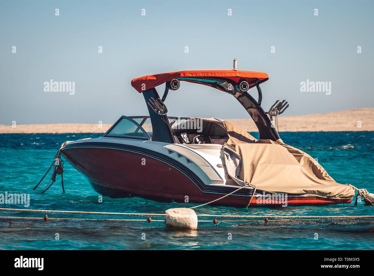 elegant Red Luxury motor boat on the background of the azure blue sea ...