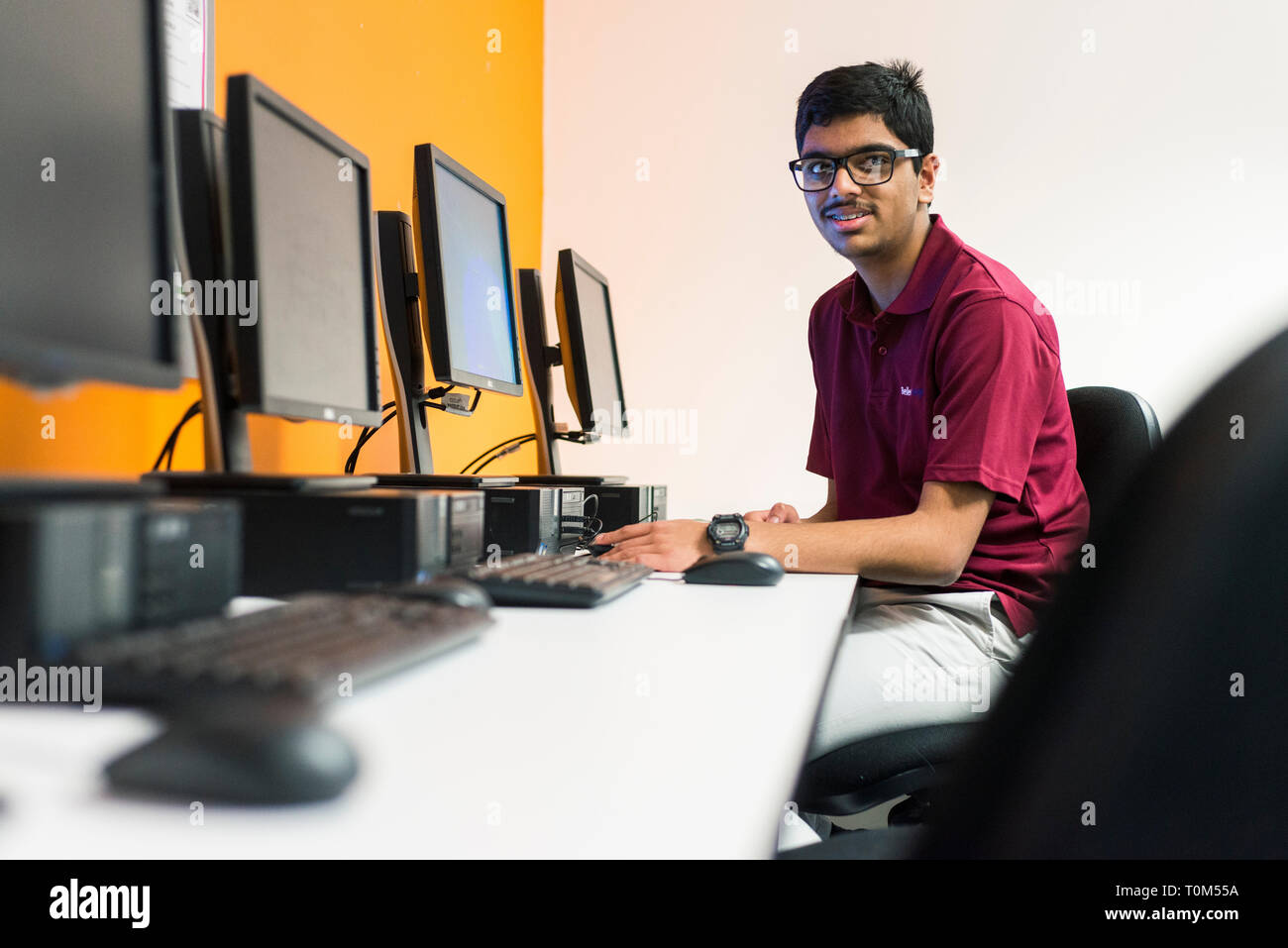 A young international student from the indian subcontinent works in the ...