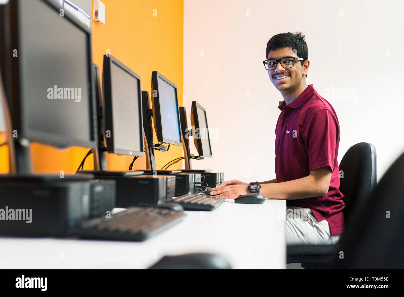 A young international student from the indian subcontinent works in the ...