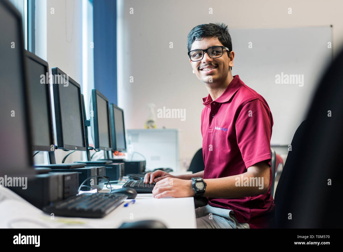 A young international student from the indian subcontinent works in the ...