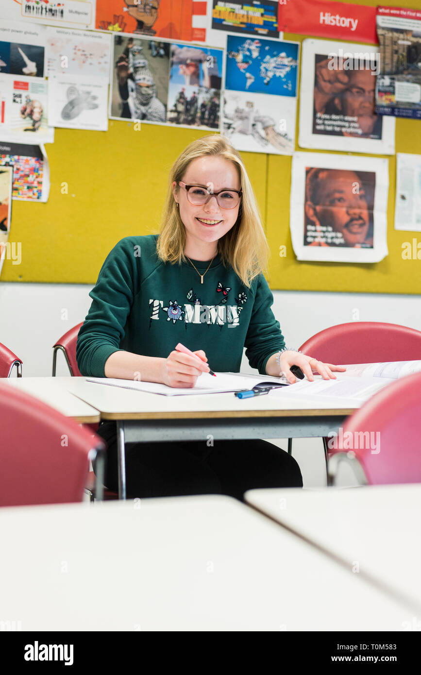 A young european student works in a classroom on campus of a Brighton ...