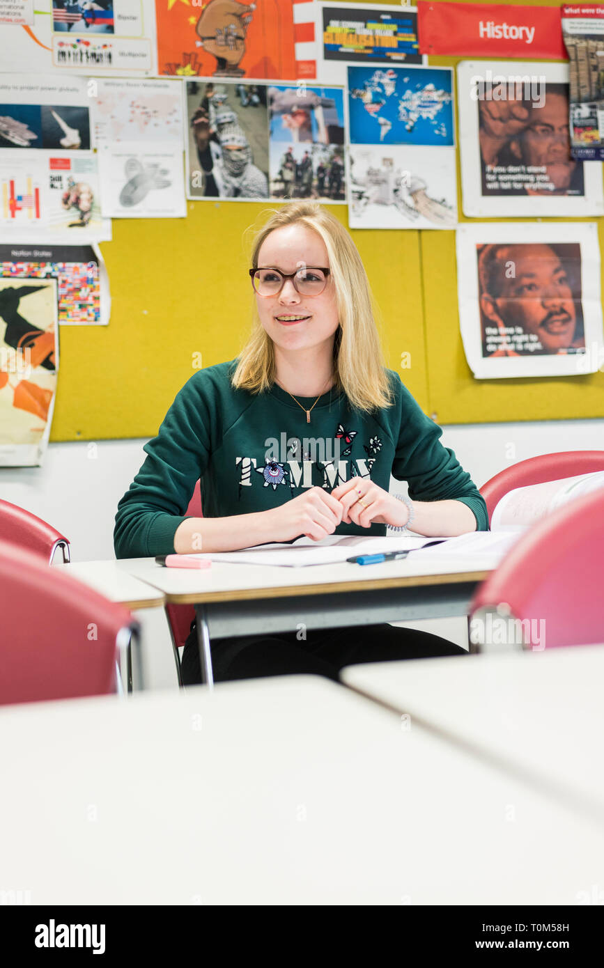 A young european student works in a classroom on campus of a Brighton ...