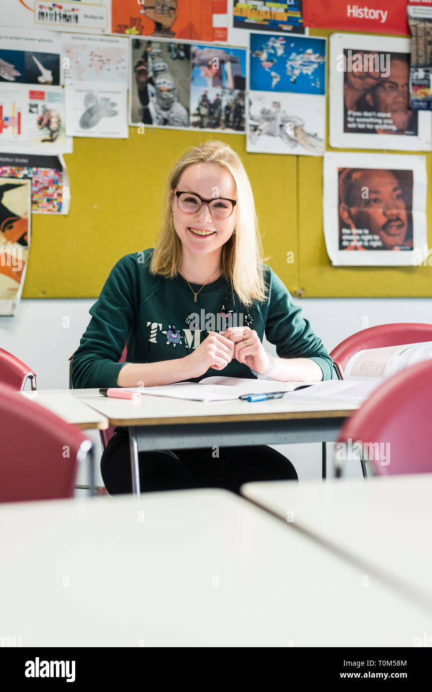 A young european student works in a classroom on campus of a Brighton ...
