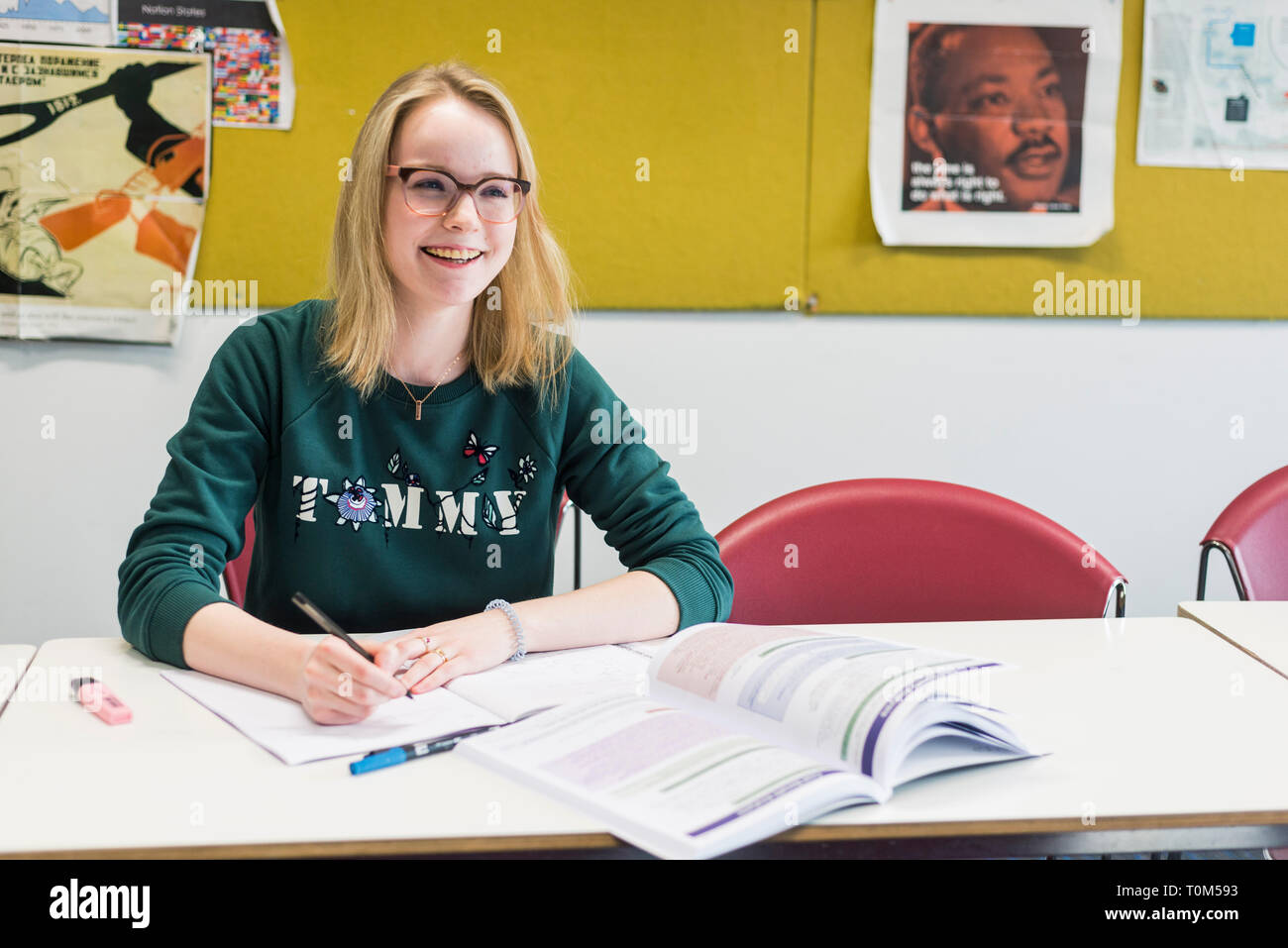 A young european student works in a classroom on campus of a Brighton ...