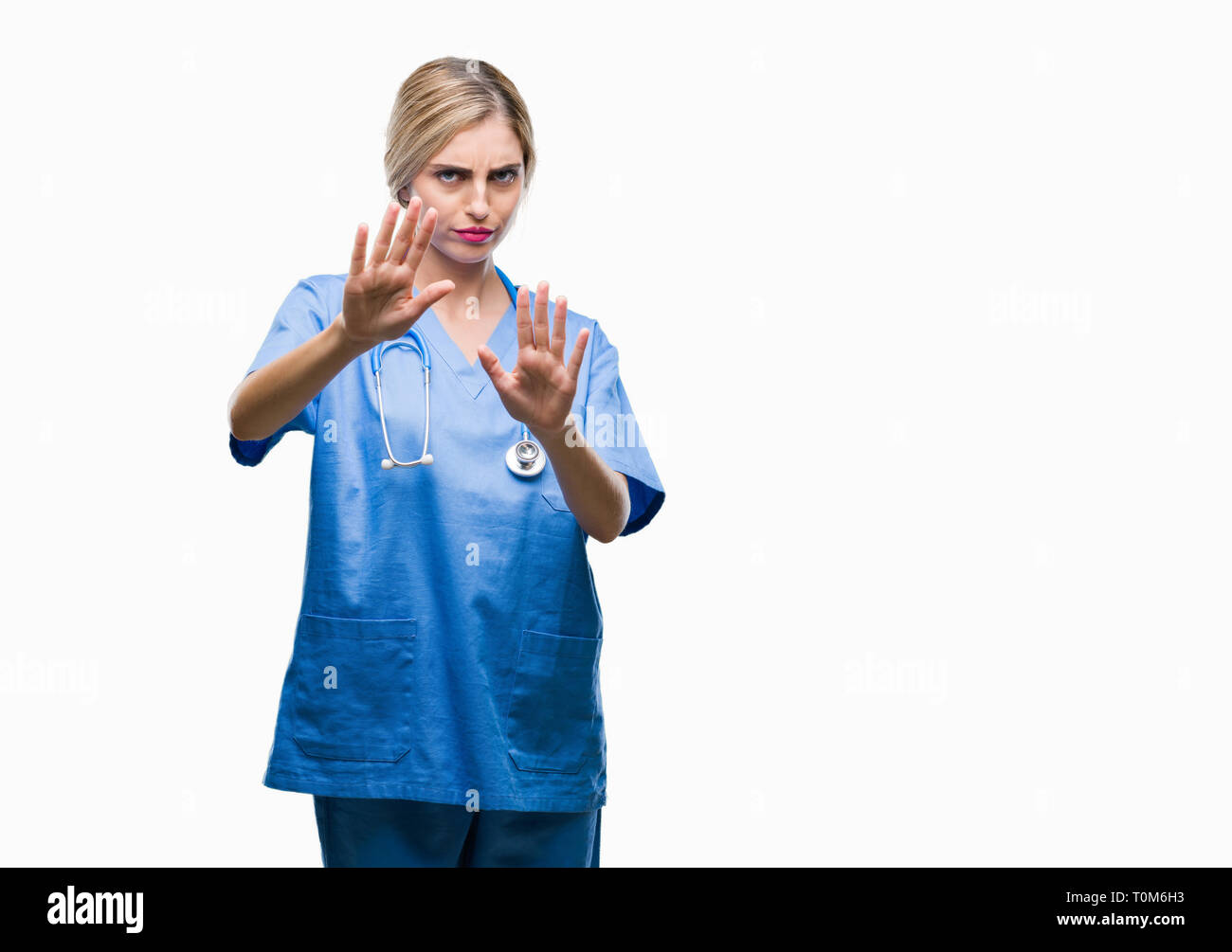 Young beautiful blonde doctor surgeon nurse woman over isolated ...