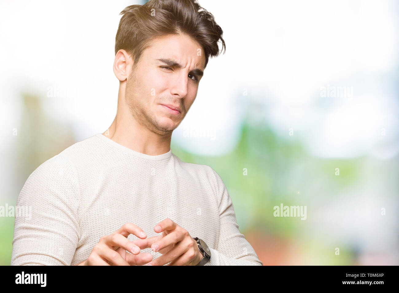 Young handsome man over isolated background disgusted expression ...