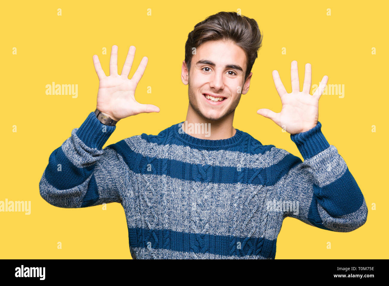 Young handsome man over isolated background showing and pointing up ...
