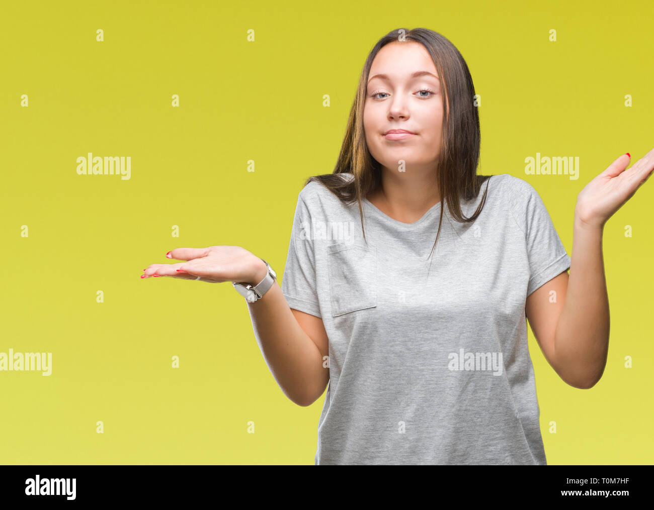 Young caucasian beautiful woman over isolated background clueless and ...