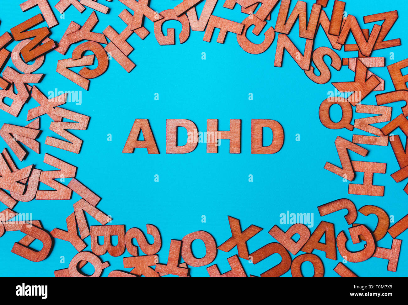 Word ADHD from wooden letters on a blue background. attention deficit ...