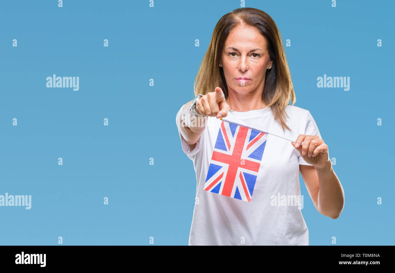 Middle age hispanic woman holding flag of United Kingdom over isolated ...