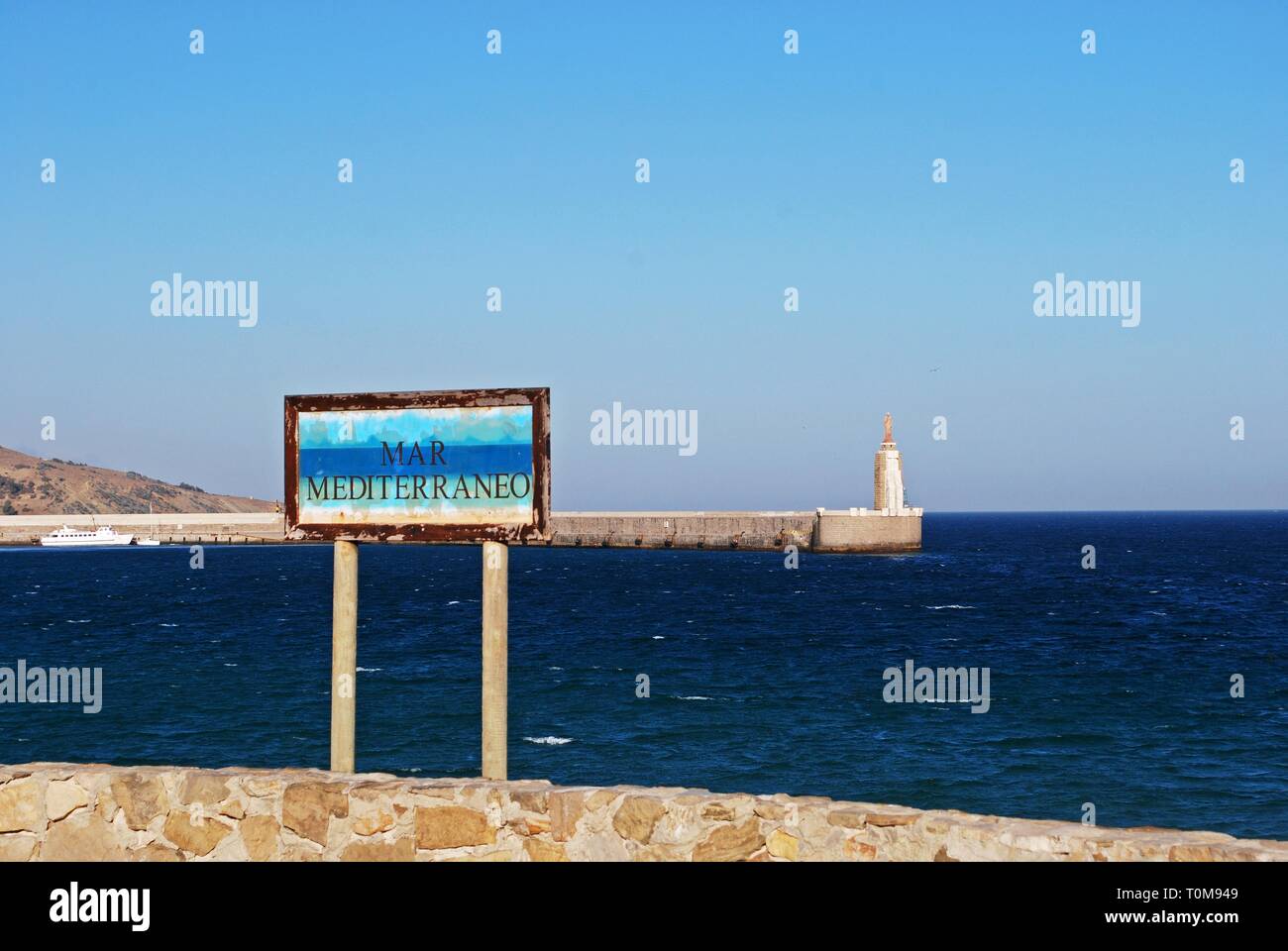 Mediterranean Sea sign with the harbour entrance to the rear, Tarifa ...