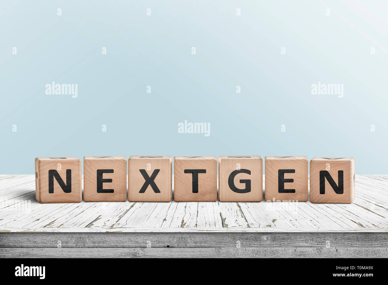 NextGen sign on a plank desk with a cyan wall in the background Stock ...
