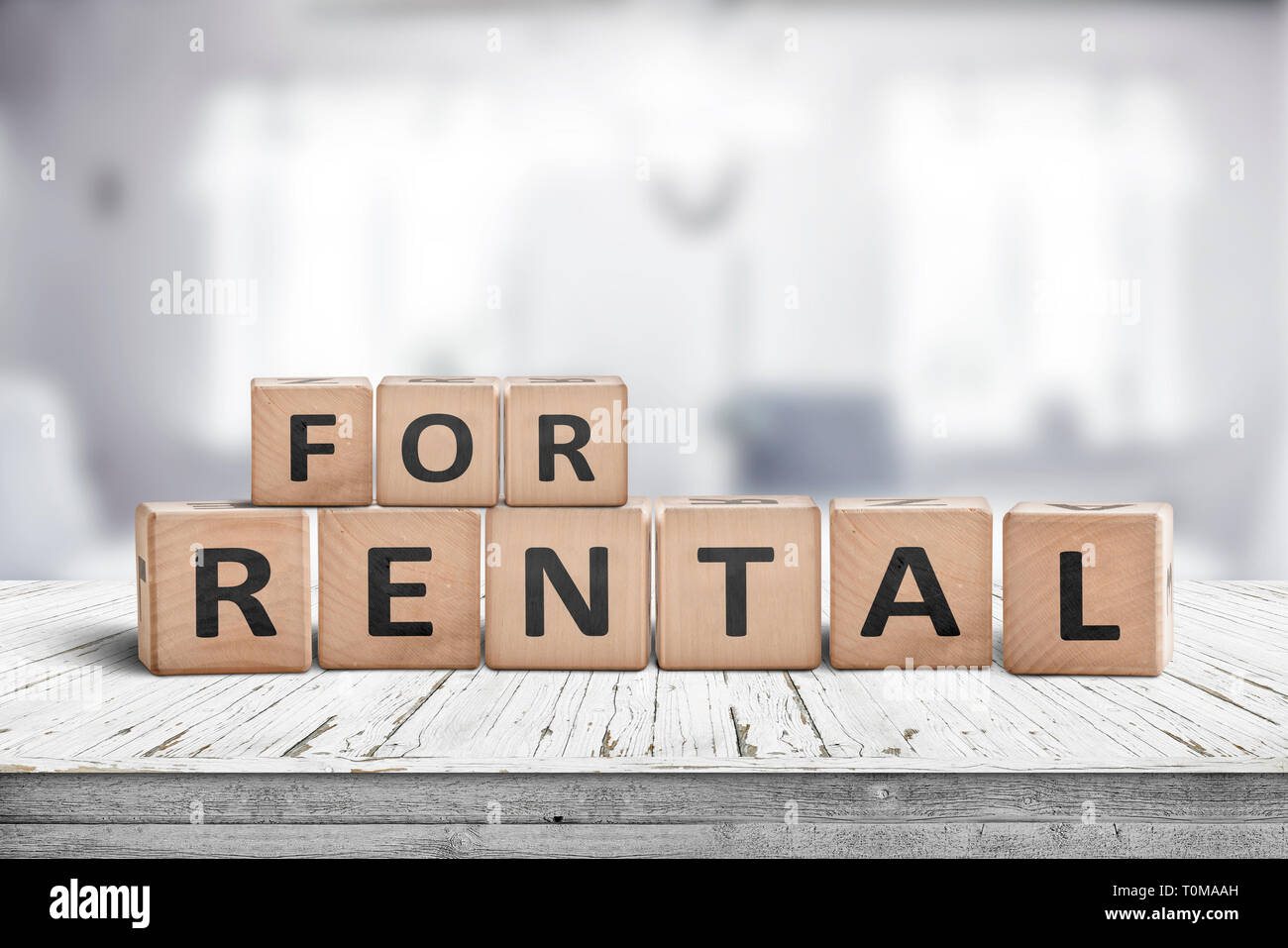 Sign with the text for rent on a desk in a living room Stock Photo - Alamy