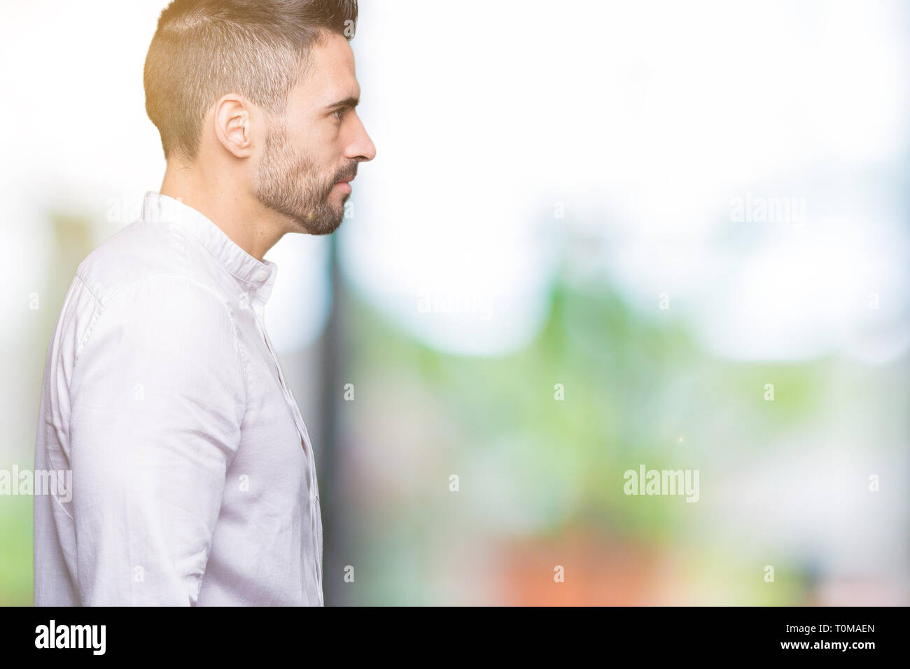 Young business man over isolated background looking to side, relax ...