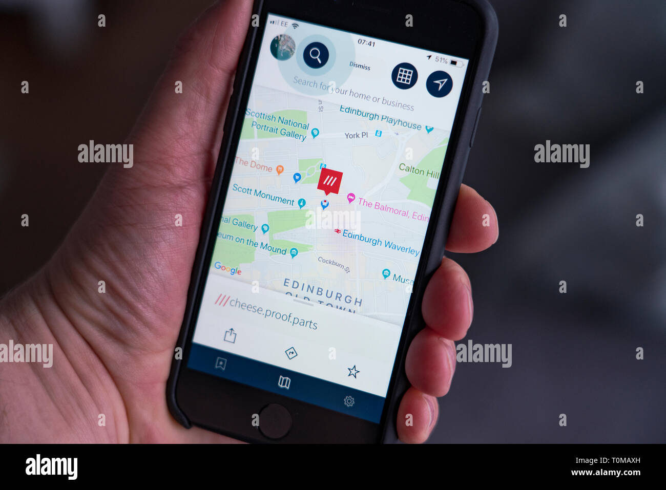 Person using What3words app on phone to locate position. The App gives ...