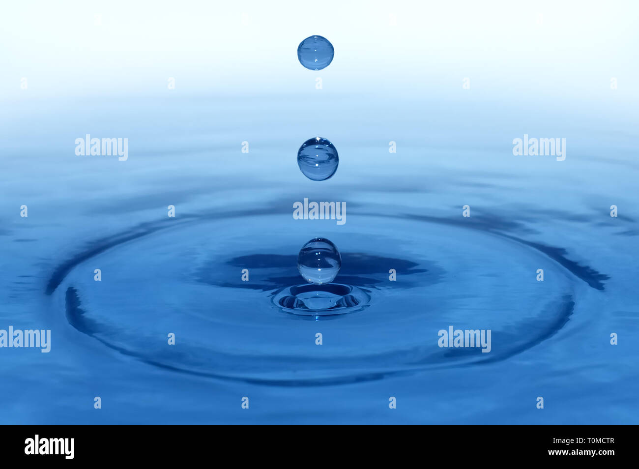 Water splash. Falling drop of rain Stock Photo - Alamy