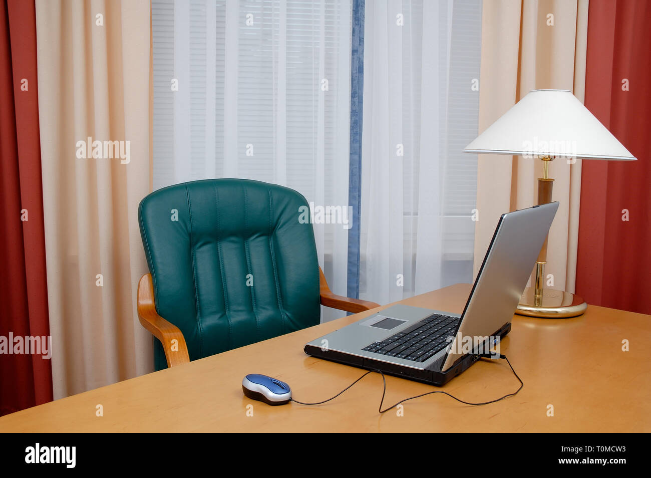View of workplace in office. Laptop on desk Stock Photo - Alamy