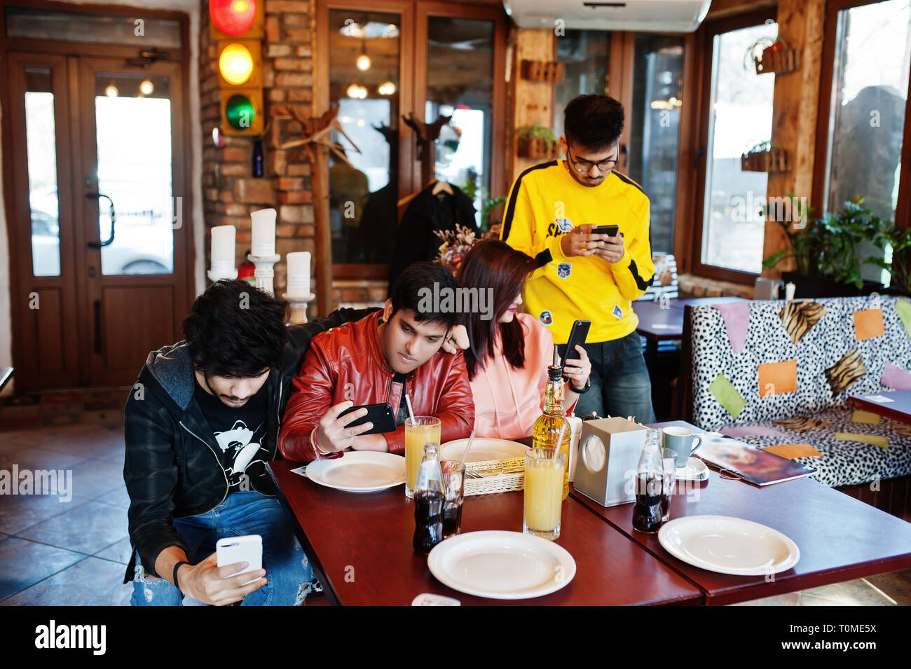 Group of asian friends sitting cafe. Happy indian people having fun ...