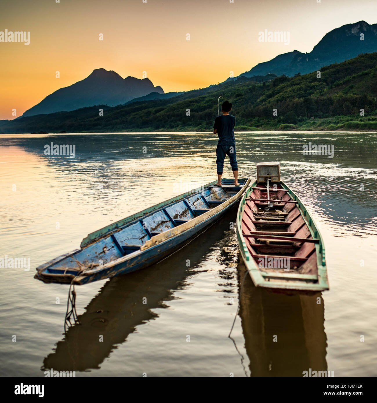 Fishing on the Mekong at sunset, Laos Stock Photo - Alamy