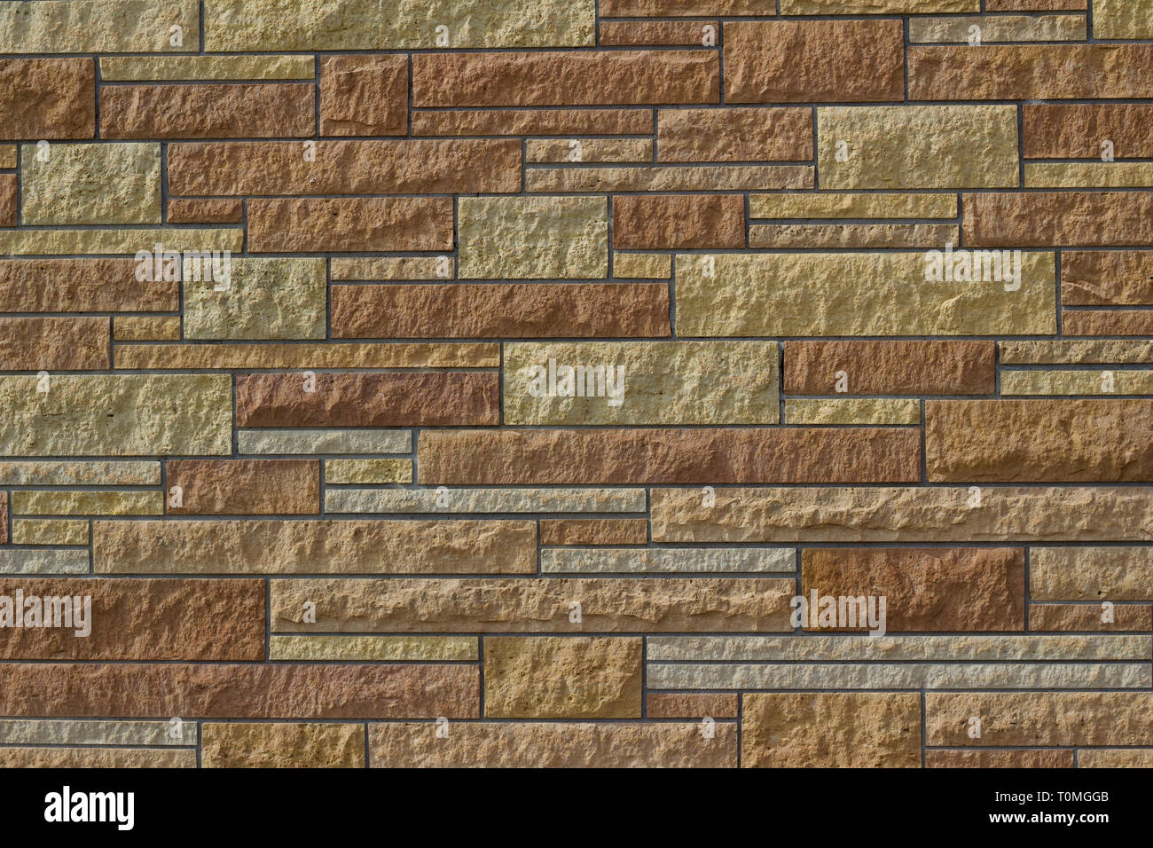 Beautiful modern limestone brick wall background in varying shades of ...